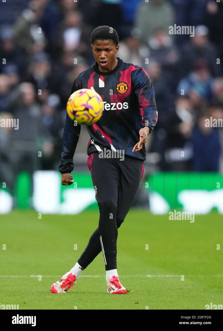 Manchester United's Chido Obi-Martin warms up ahead of the Premier ...