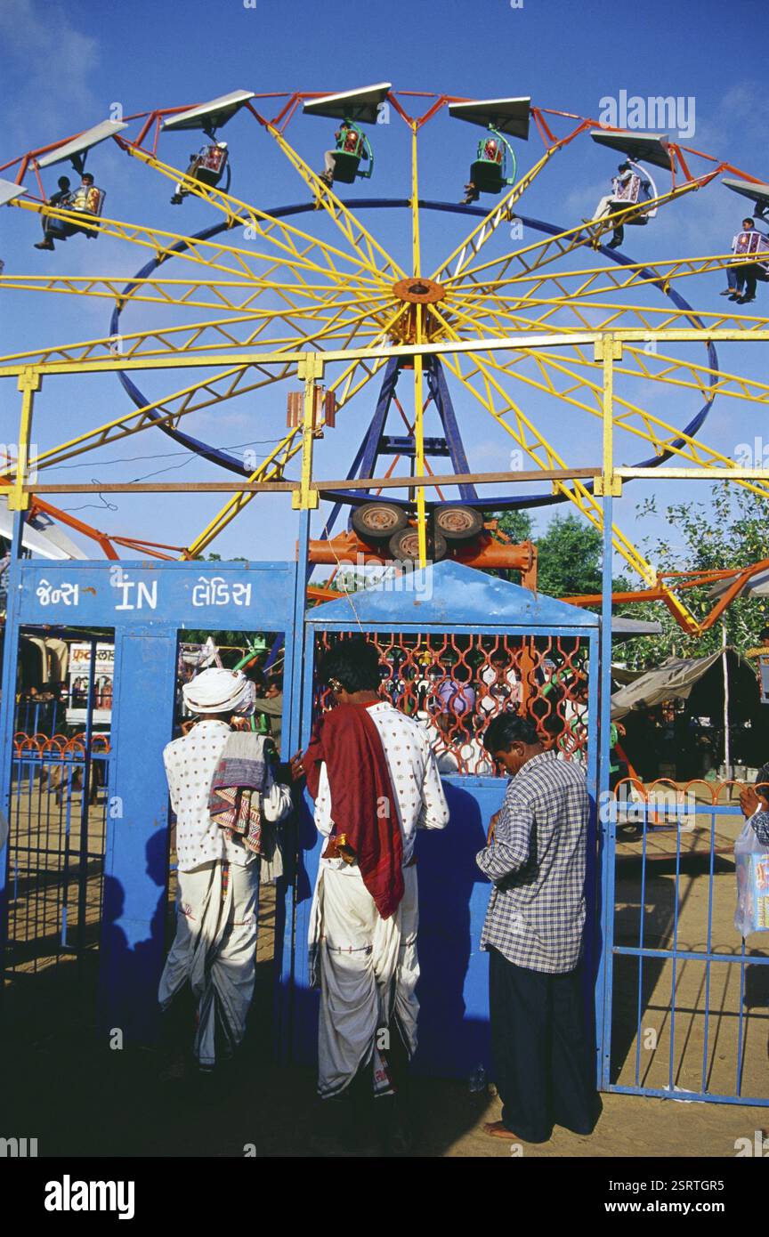 People enjoying giant wheel in Ravechi fair, Kutch, Gujarat, India ...