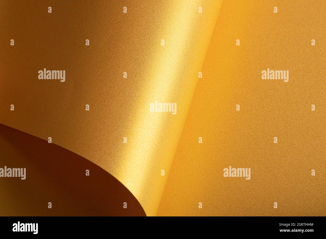 Golden saffron paper background with a pearlescent, glossy texture and ...