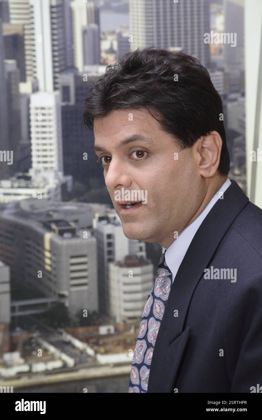 Executive profile of matured in office at top floors of skyscraper in ...