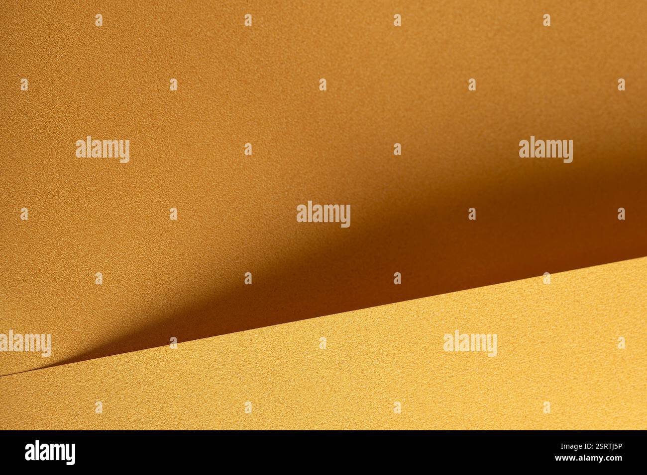 Golden yellow paper background with deep ochre and saffron tones ...