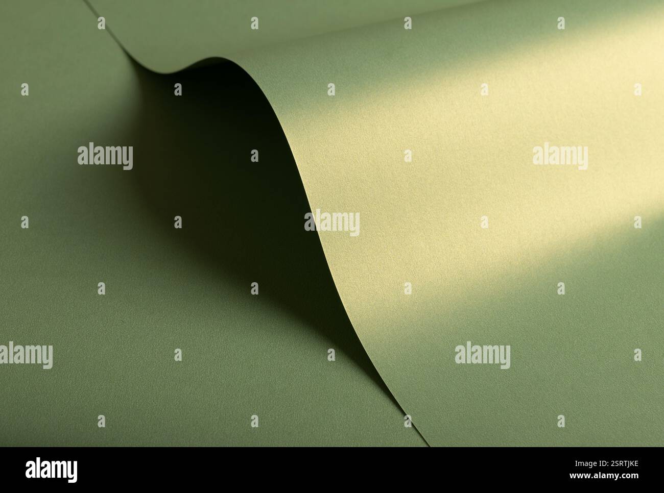 Pastel olive green paper background with a pearlescent, glossy texture ...