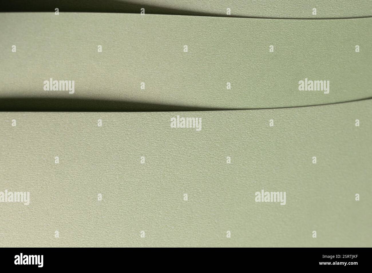 Pastel sage green paper background with a soft texture and layered ...