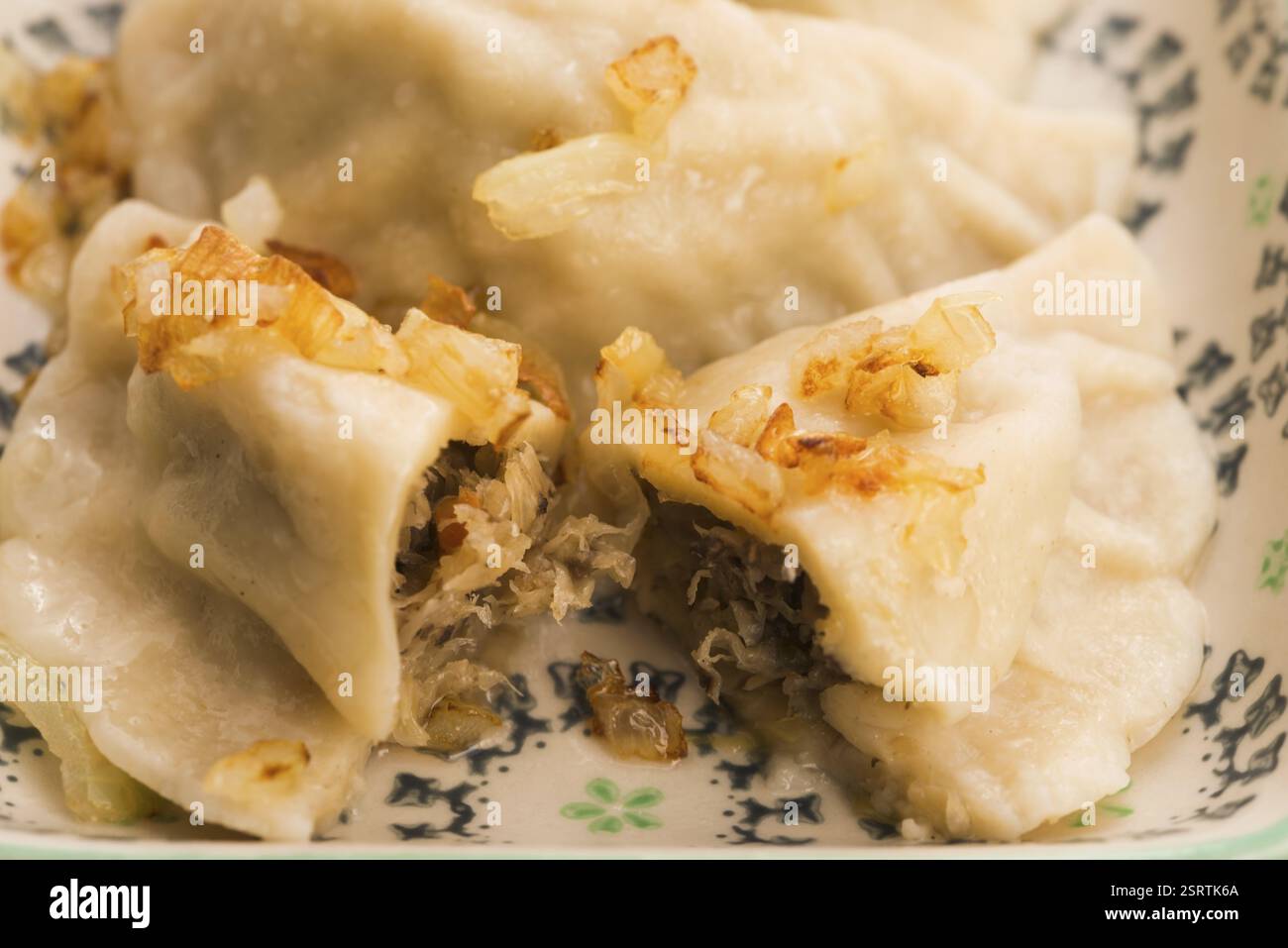 Polish pierogi filled with cabbage and mushrooms Stock Photo - Alamy