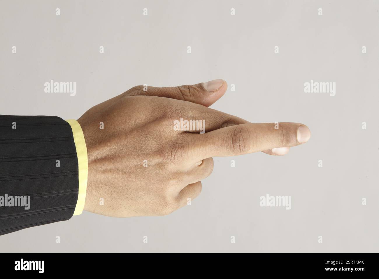 Businessman showing close up of hand kept his index and middle finger ...