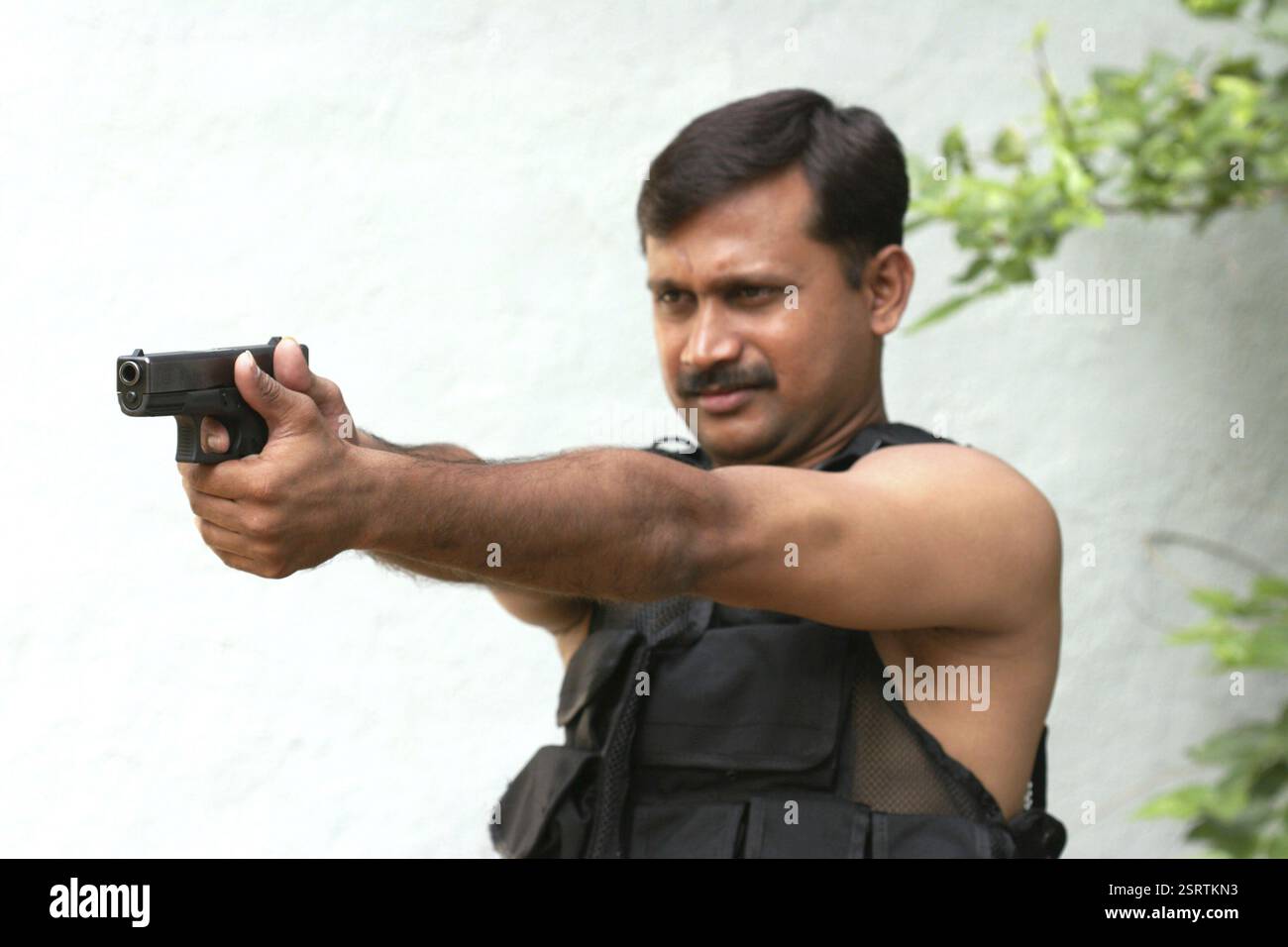 Black Cat commando with a revolver, Glock MR Stock Photo - Alamy