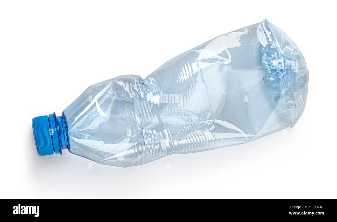 Empty crushed plastic bottle with blue cap lying on a white background ...