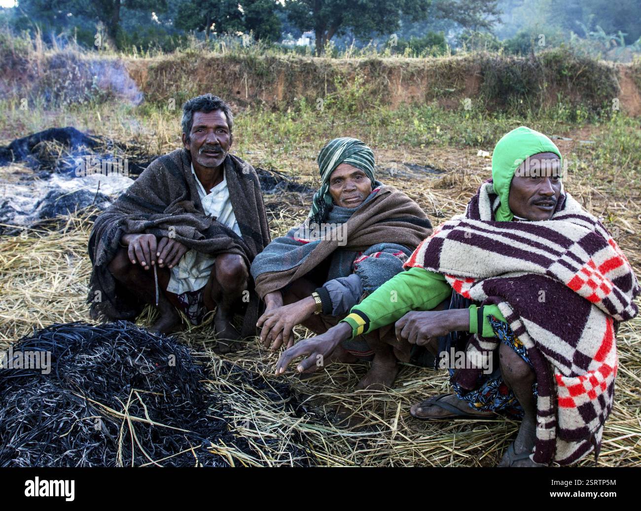 Farmers warming hands over fire, Araku, Andhra Pradesh, India, Asia ...