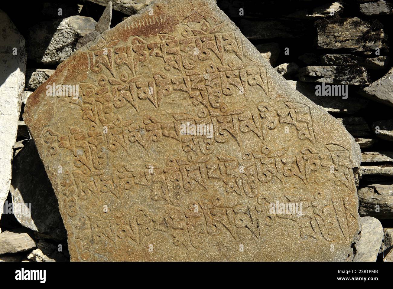 Stone engraved buddhist mantra hi-res stock photography and images - Alamy
