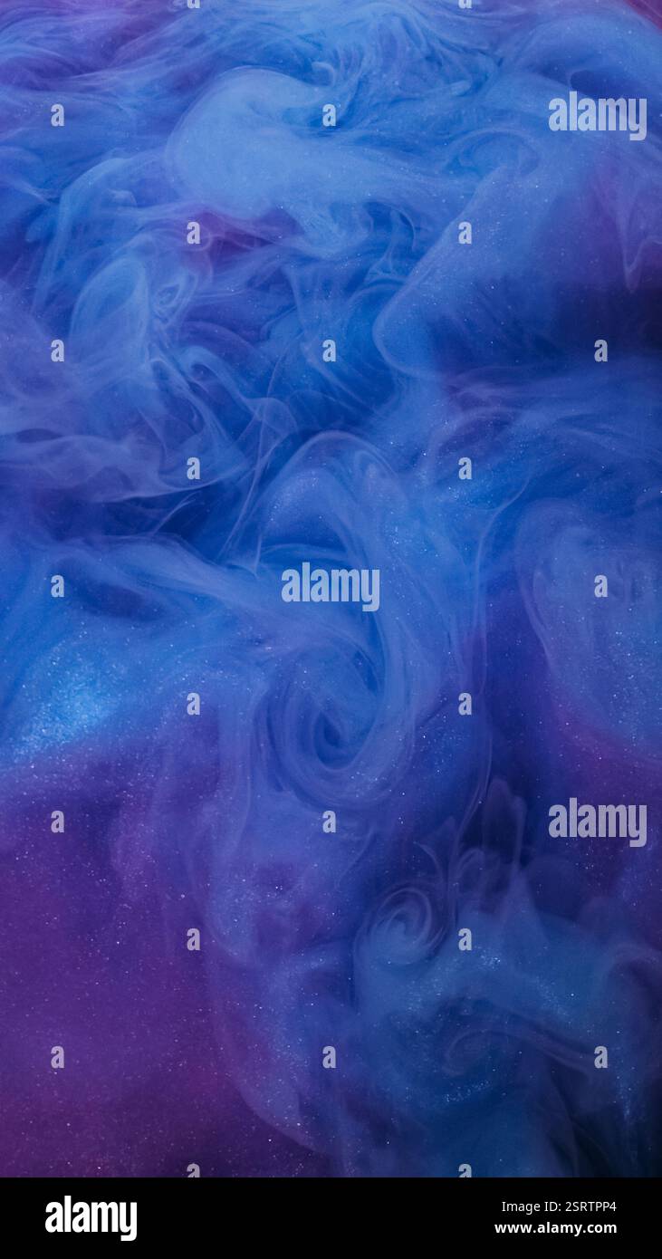 Ink explosion. Smoke cloud. Defocused blue purple color haze paint mist ...