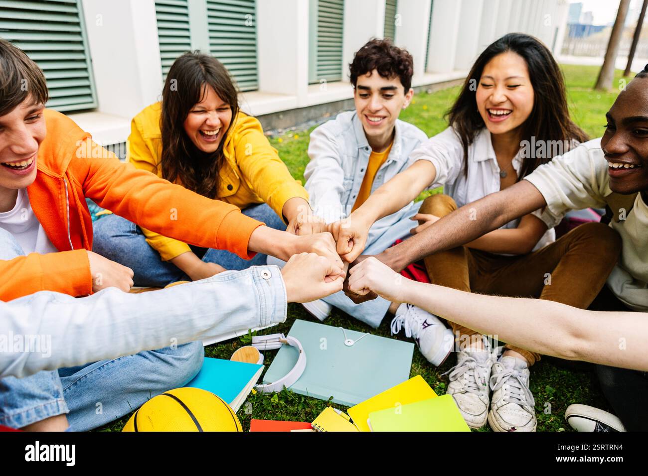 Group school friends joining hi-res stock photography and images - Alamy