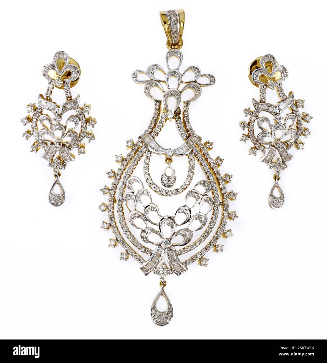 Diamond with gold jewellery pendent with ear tops on white background ...