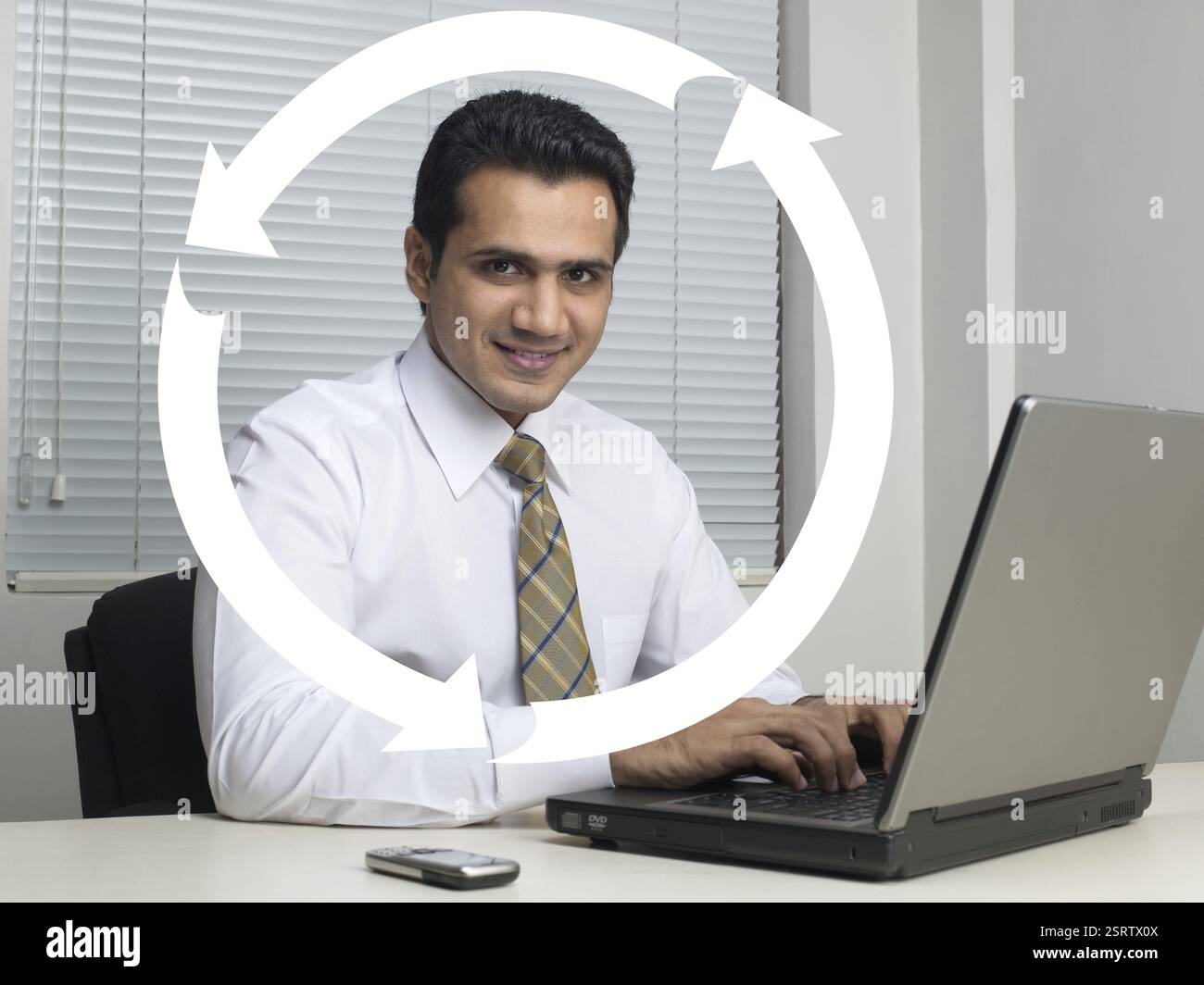 Executive operating laptop around with arrow sign MR #779K Stock Photo ...