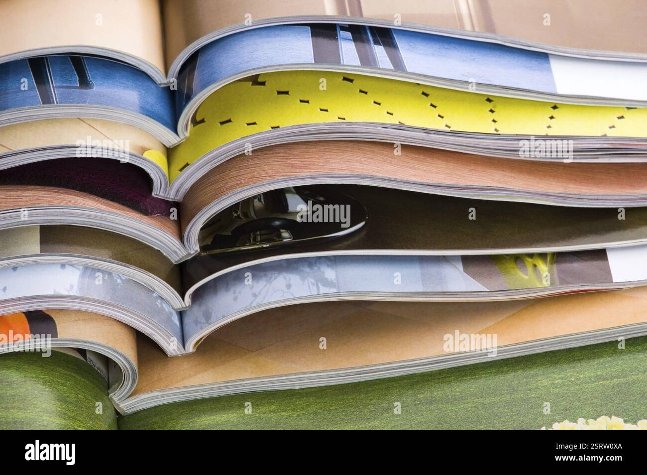 Stack of open magazines Stock Photo - Alamy