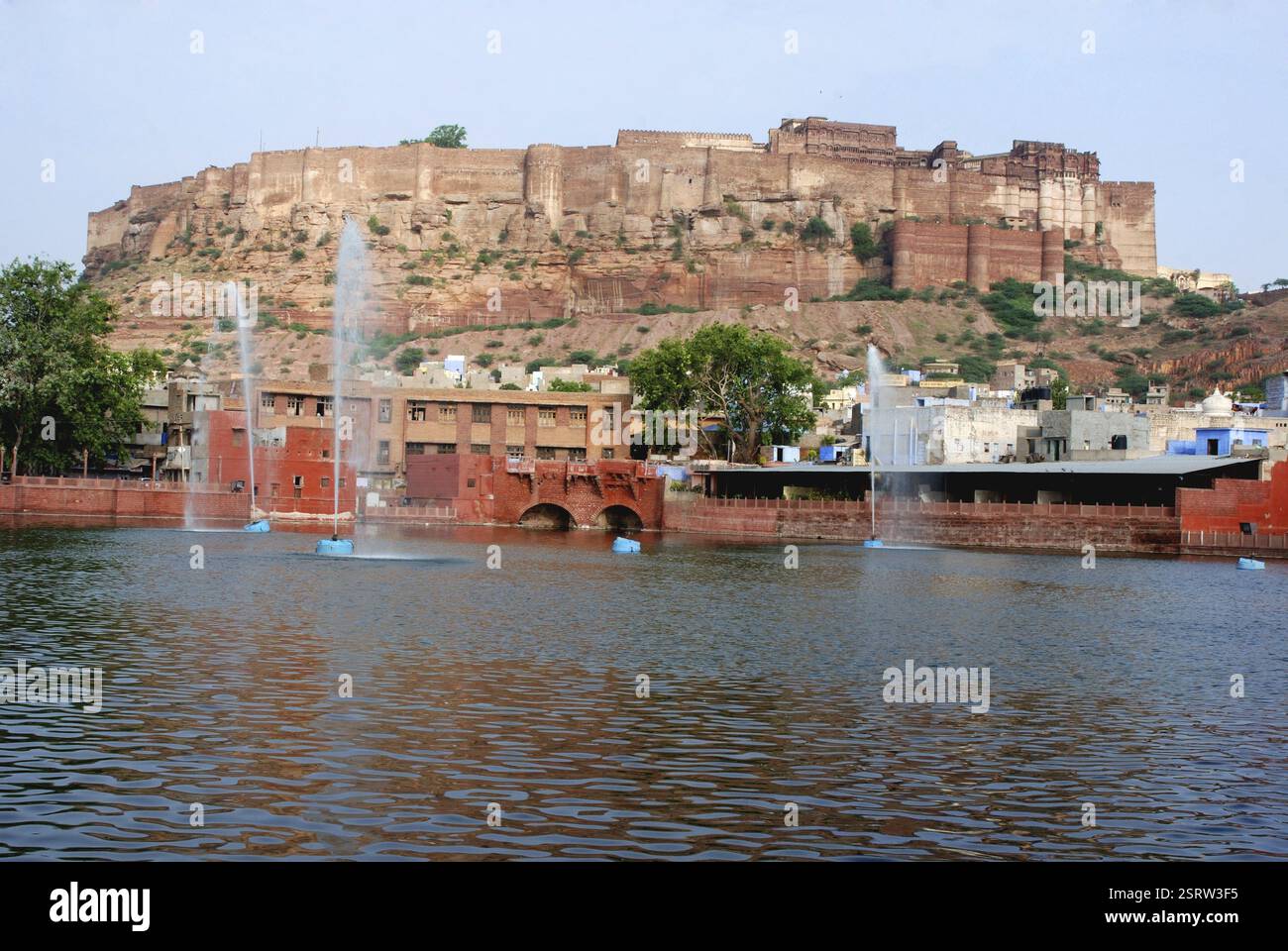 Mehrangarh fort in backdrop of gulab sagar pond with fountain and ...