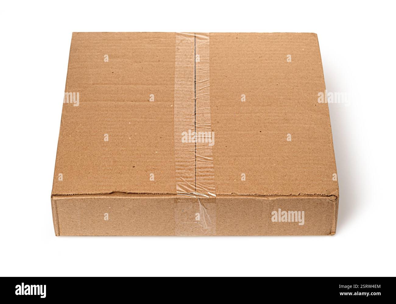 Single closed cardboard box sealed with adhesive tape, isolated on ...