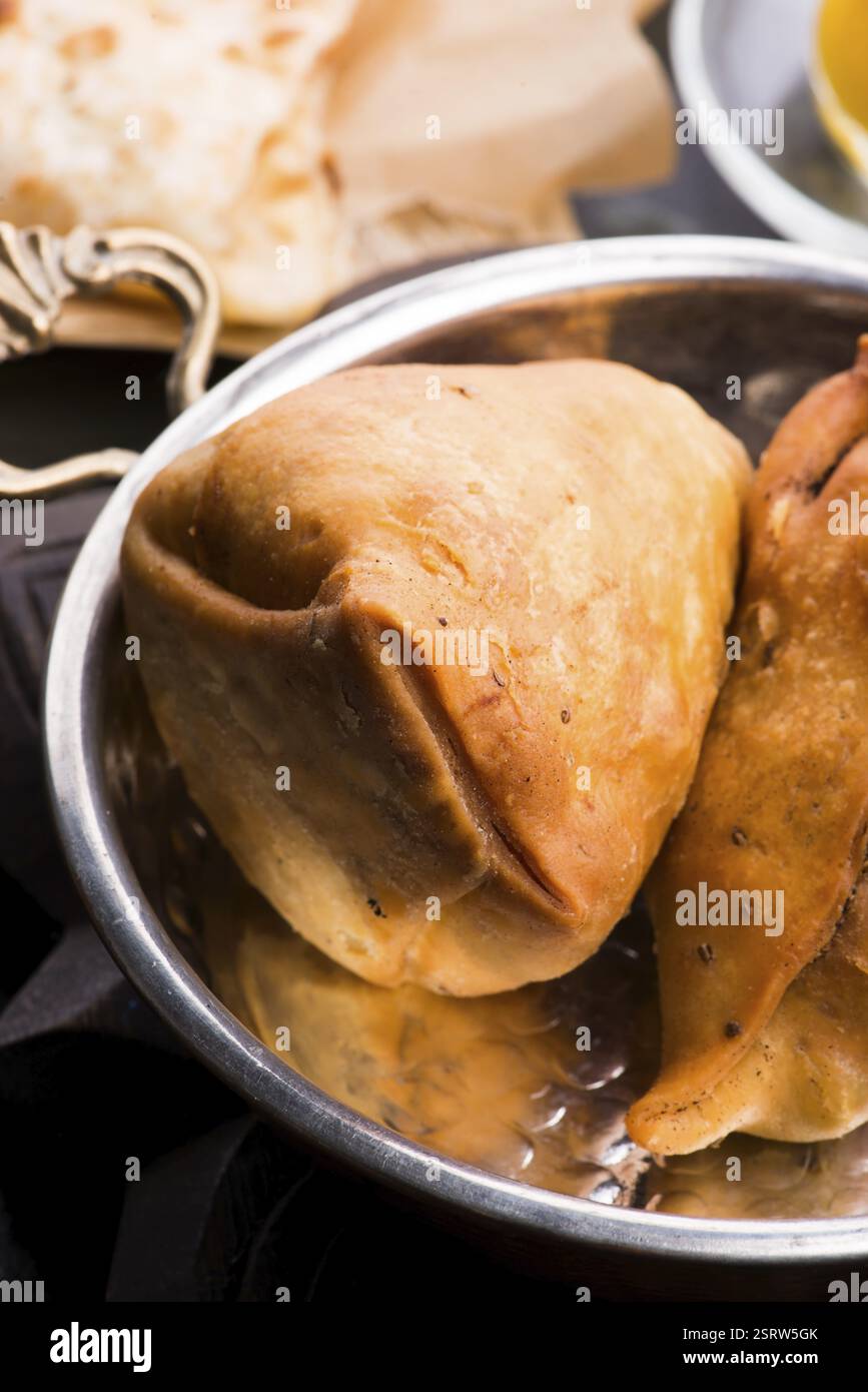 Veg Samosa - is a crispy and spicy Indian triangle shape snack Stock ...
