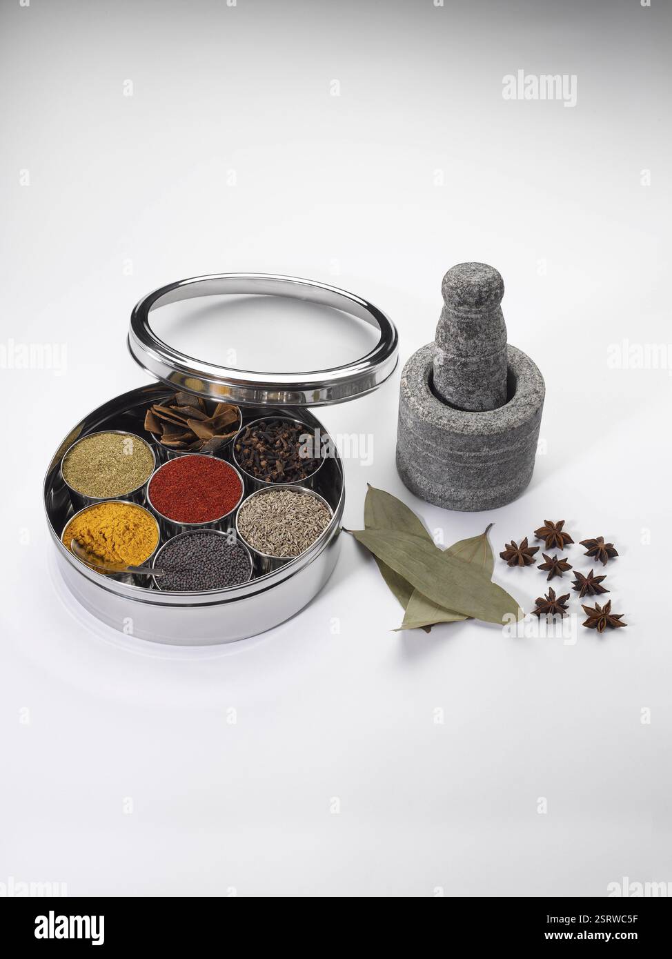 Different types of spices in bowls in stainless steel box with old ...