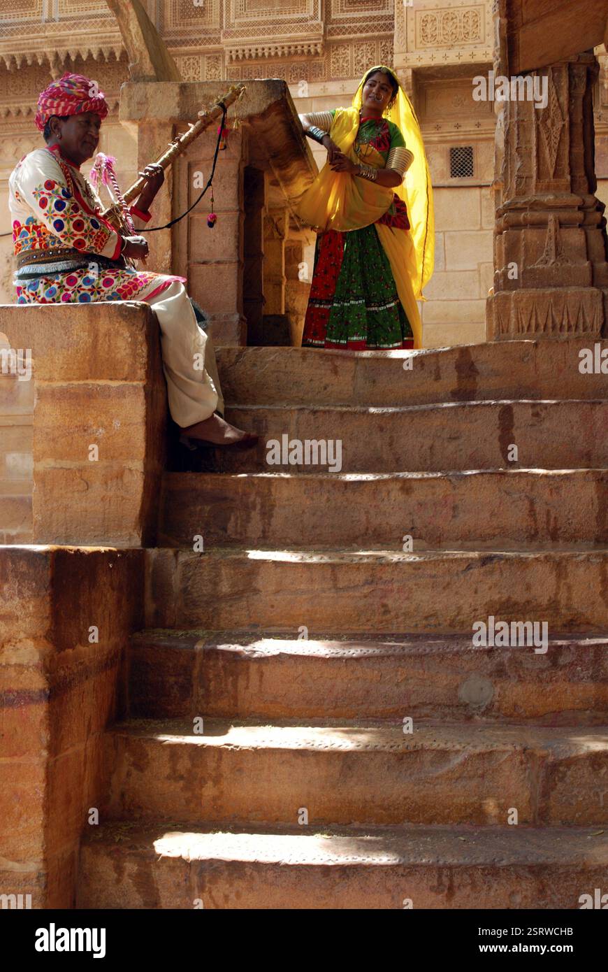 Rajasthani marwari lady listening ravanhatta played by folk musician ...