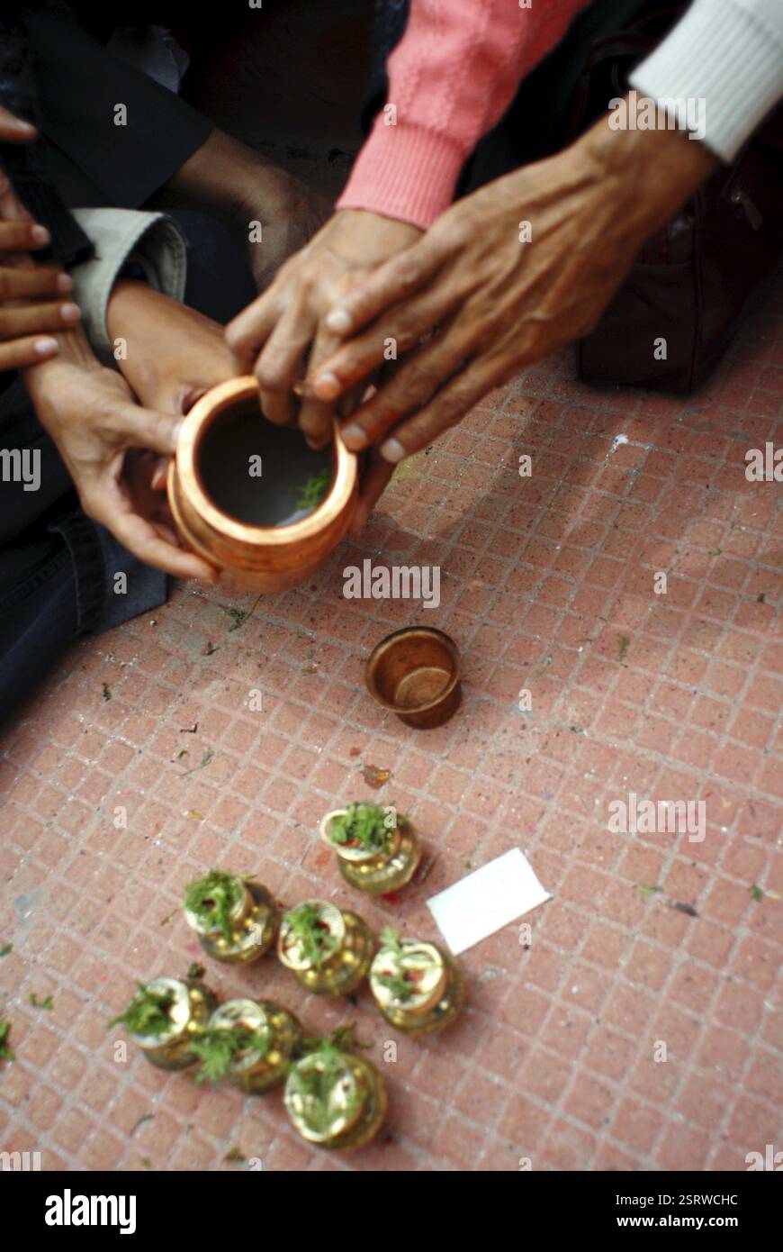 Devotees worship copper cans holy water can close-ups closeups Color ...