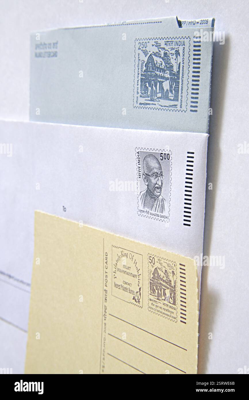 Concept, inland letter card stamped envelope and postcard on white ...