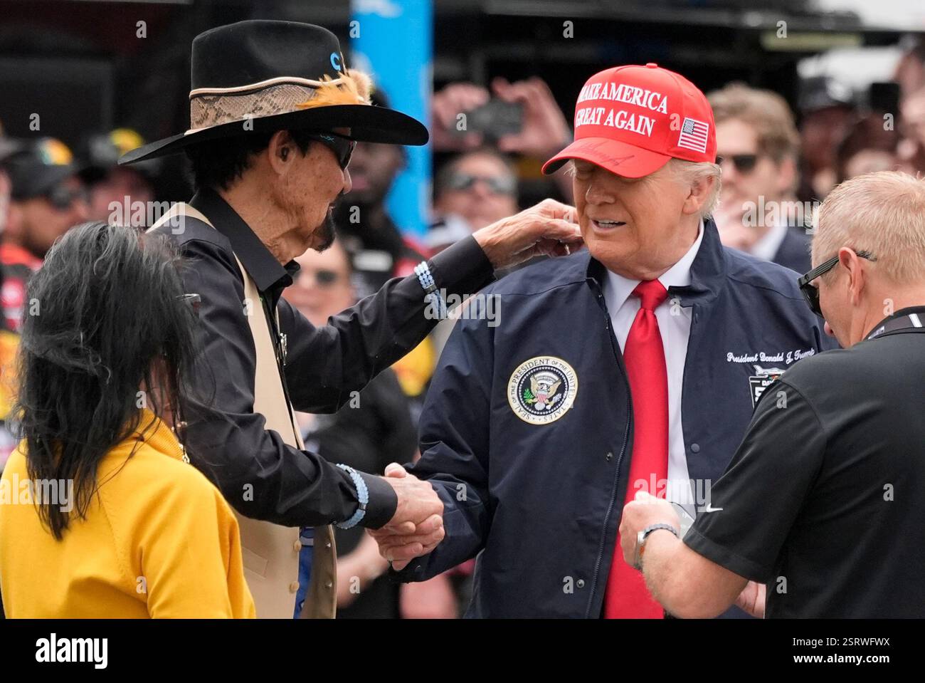 President Donald Trump, right, shakes hands with NASCAR Hall of Fame ...