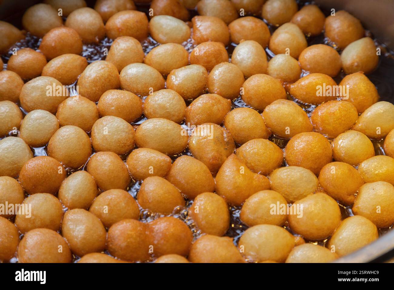 Traditional Turkish dessert lokma. Lokma is a dessert made of leavened ...