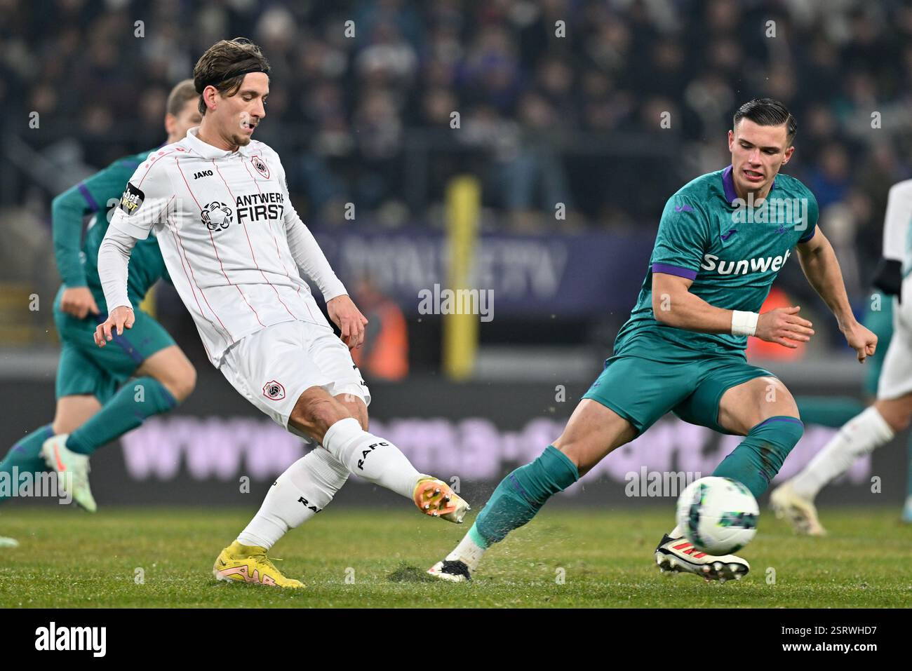 Anderlecht, Belgium. 16th Jan, 2025. Dennis Praet (8) of Antwerp pictured with Jan-Carlo Simic ...