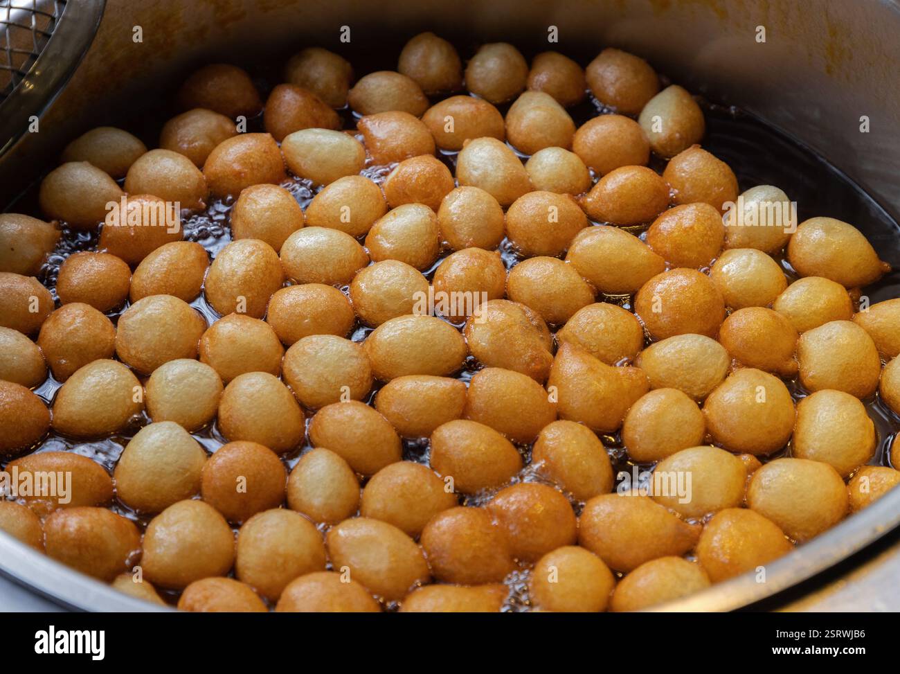 Traditional Turkish dessert lokma. Lokma is a dessert made of leavened ...