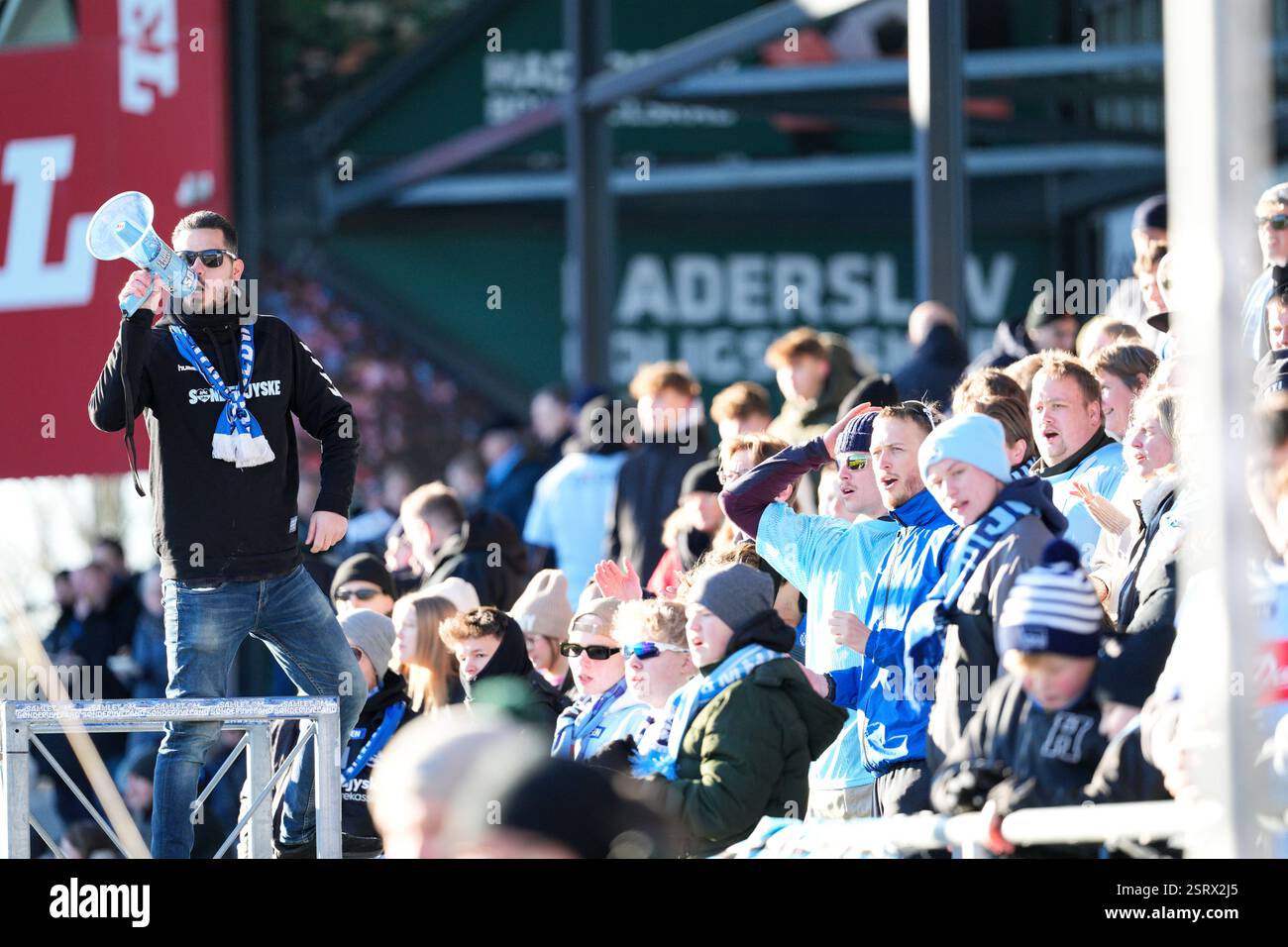 Haderslev, Denmark. 16th Feb, 2025. SoenderjyskE fans warm up for the Superliga match between ...