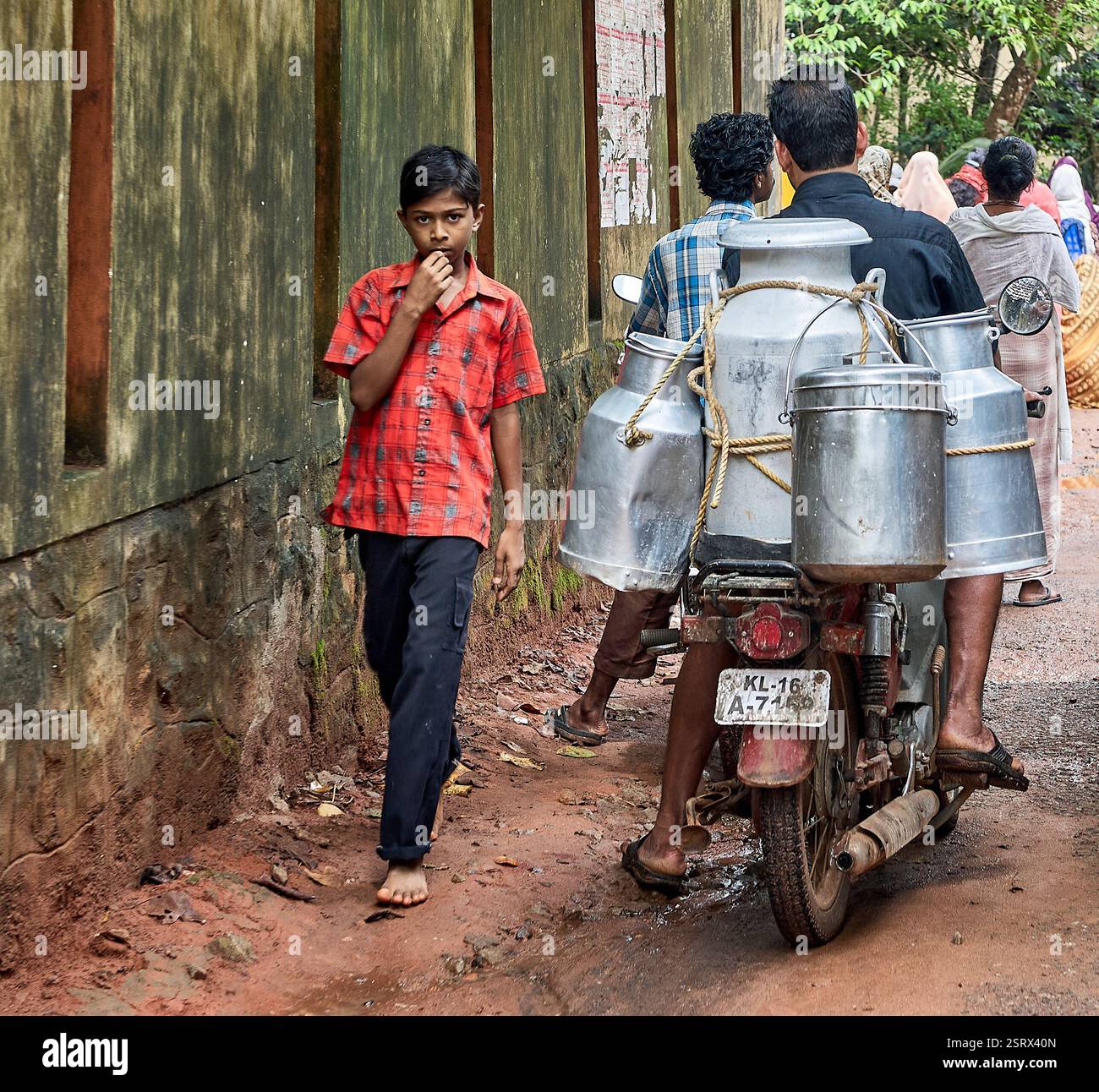 Road in Alleppey, Kerala, India, showing a lad walking and another ...