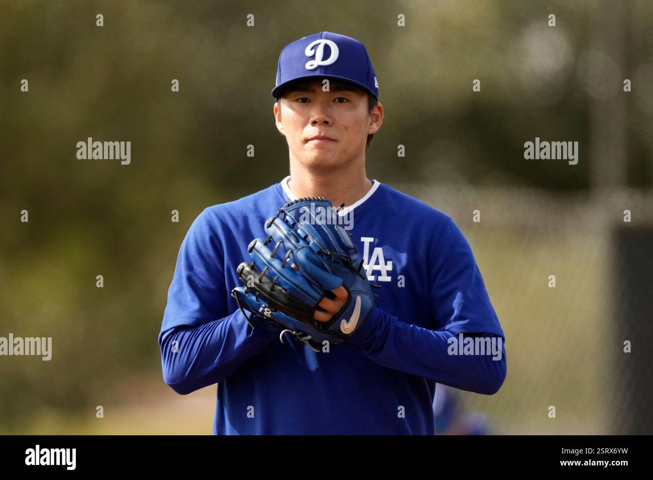 Los Angeles Dodgers pitcher Yoshinobu Yamamoto works out during spring ...