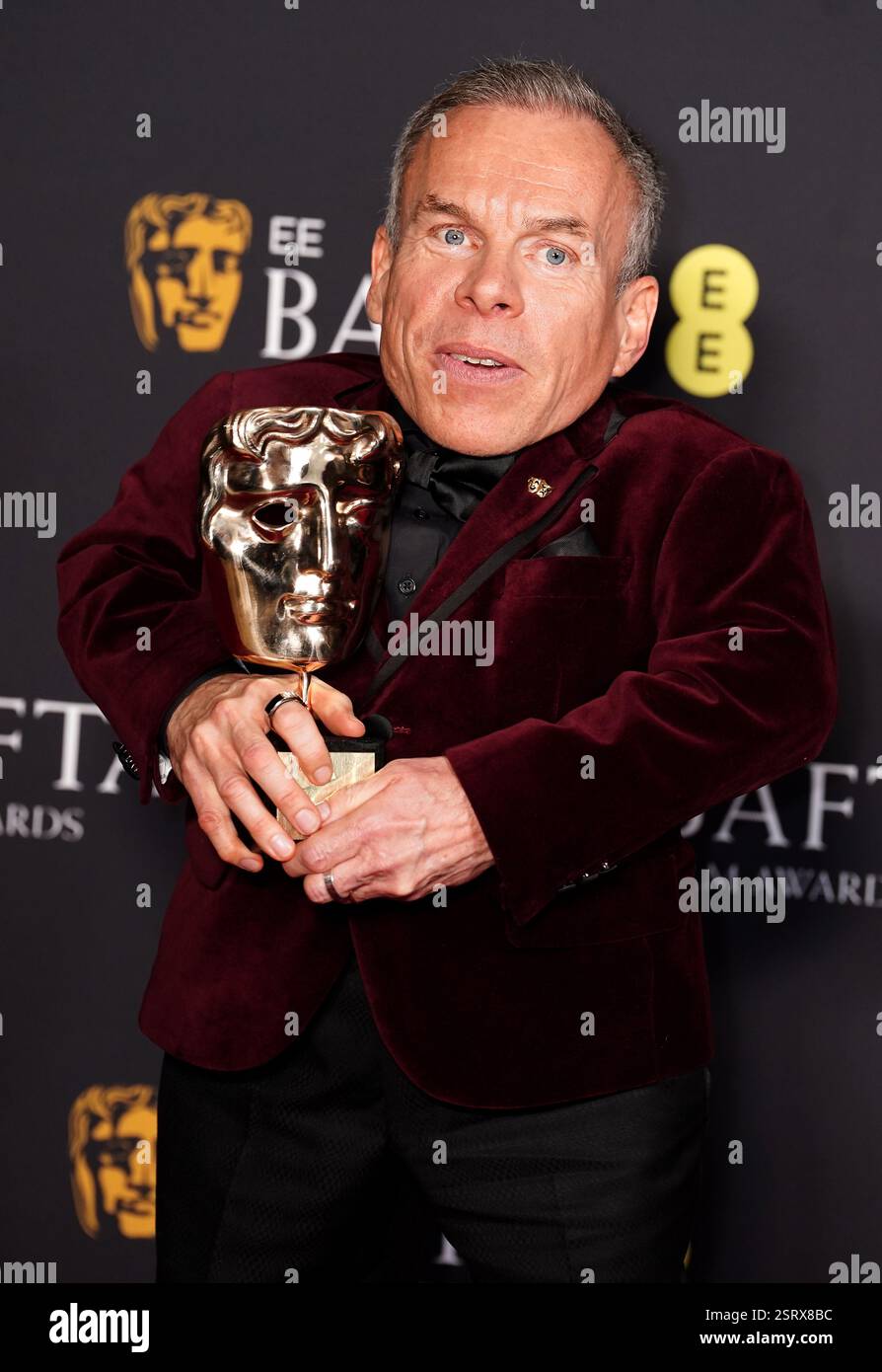 Warwick Davis in the press room after winning the BAFTA Fellowship ...