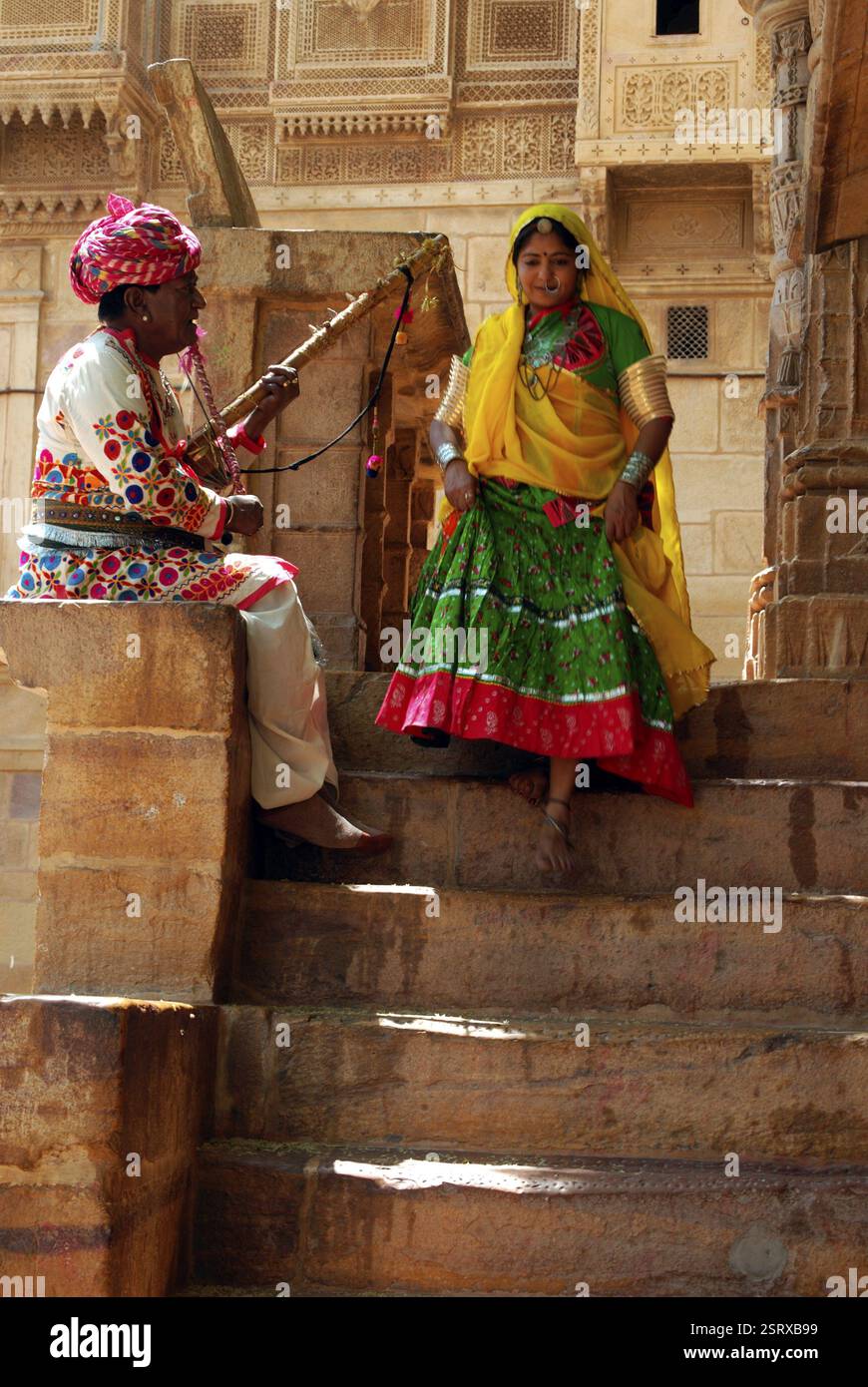 Rajasthani marwari lady stepping down folk musician playing ravanhatta ...