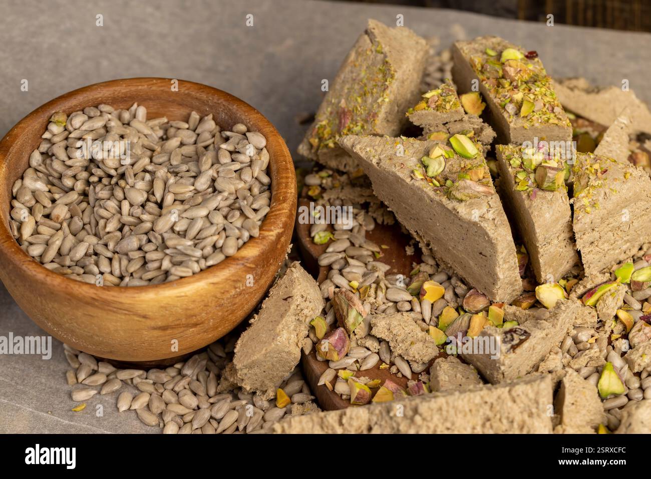 halva from sunflower seeds with pistachios, a sweet delicious dessert made from fried sunflower ...