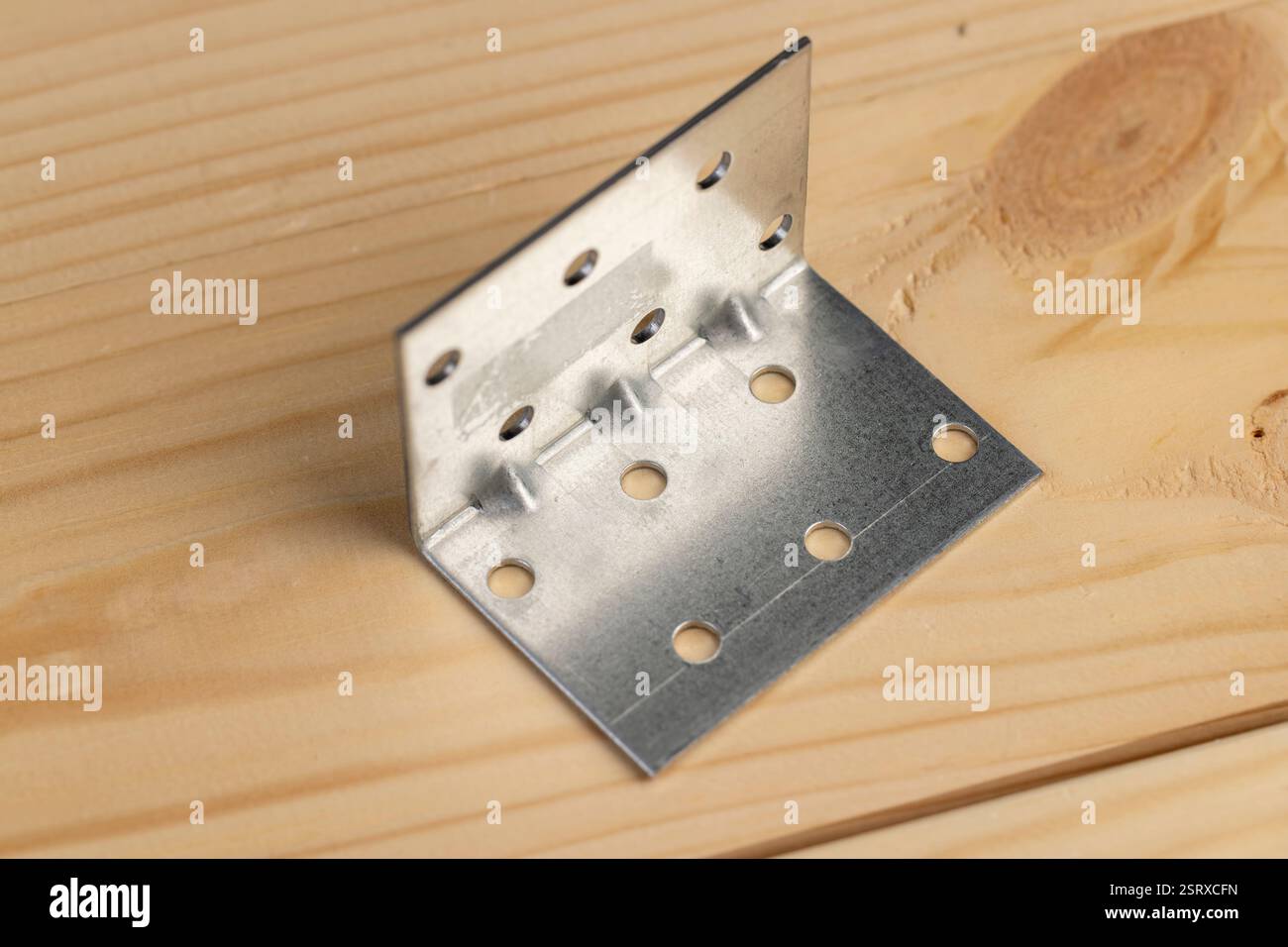 one silver metal corner for connecting wooden parts with screws, metal ...