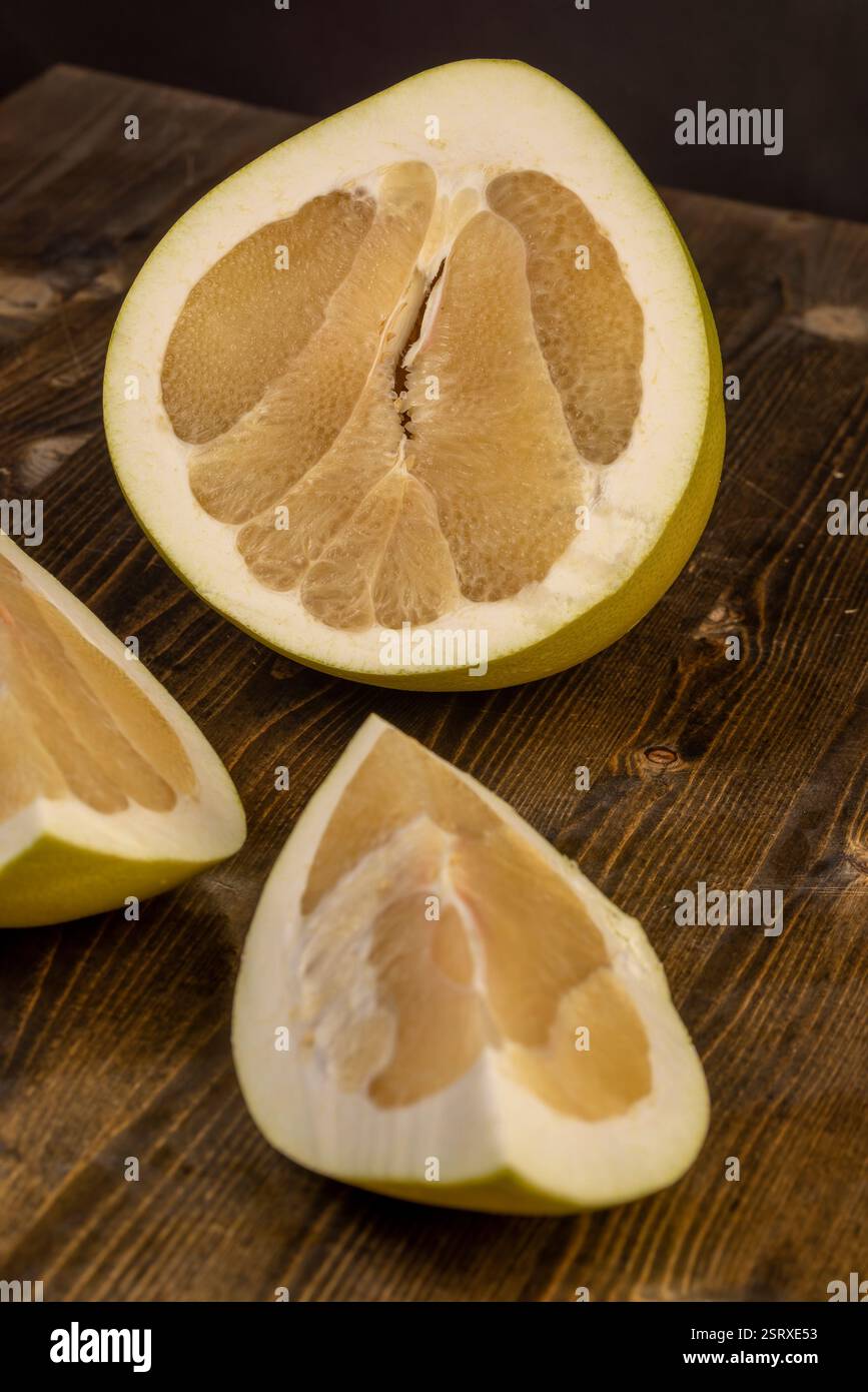 ripe and juicy citrus fruit of large size cut into pieces, huge juicy ...