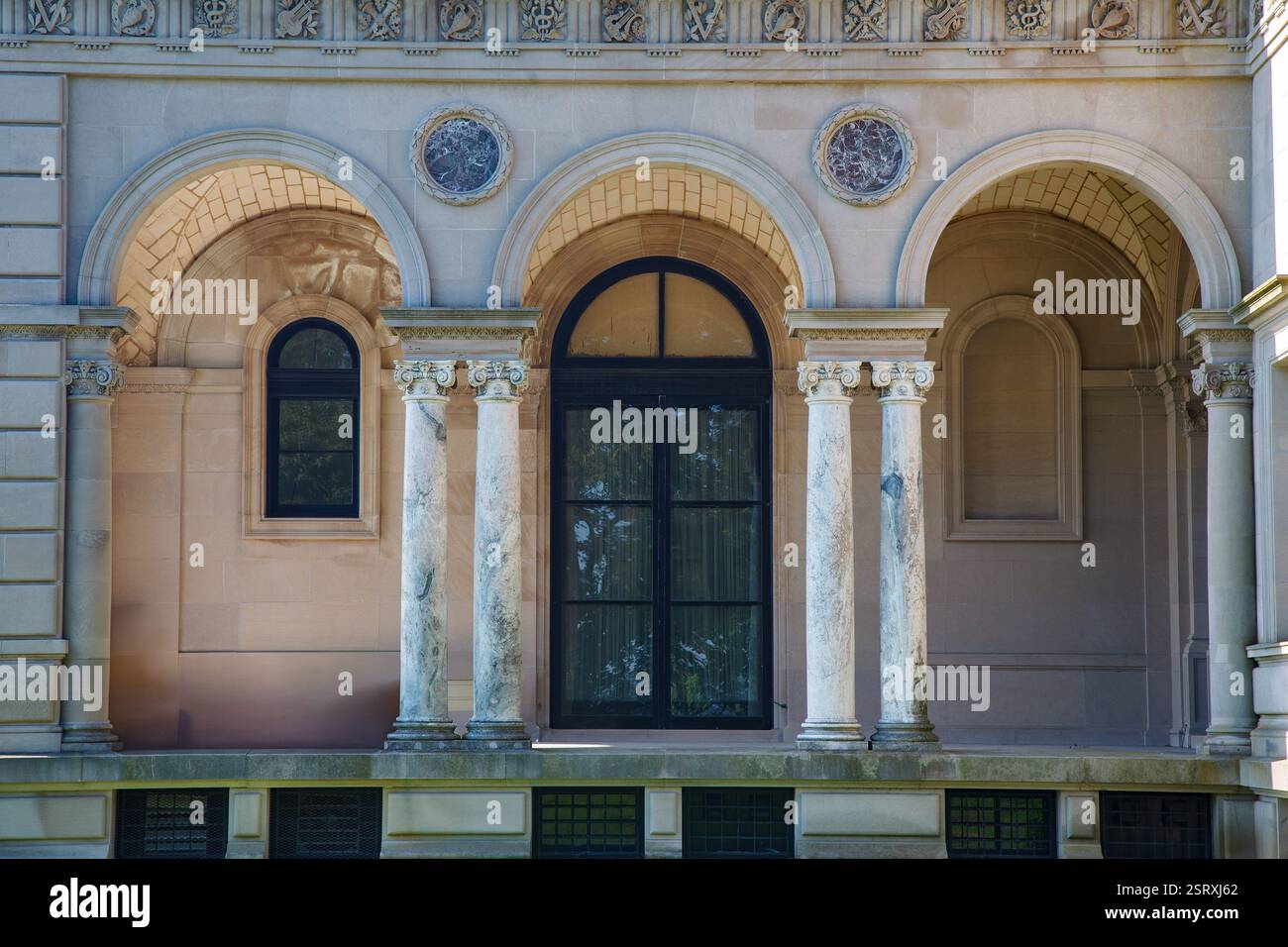 A Detail of the windows with arches and corinthian columns at ...