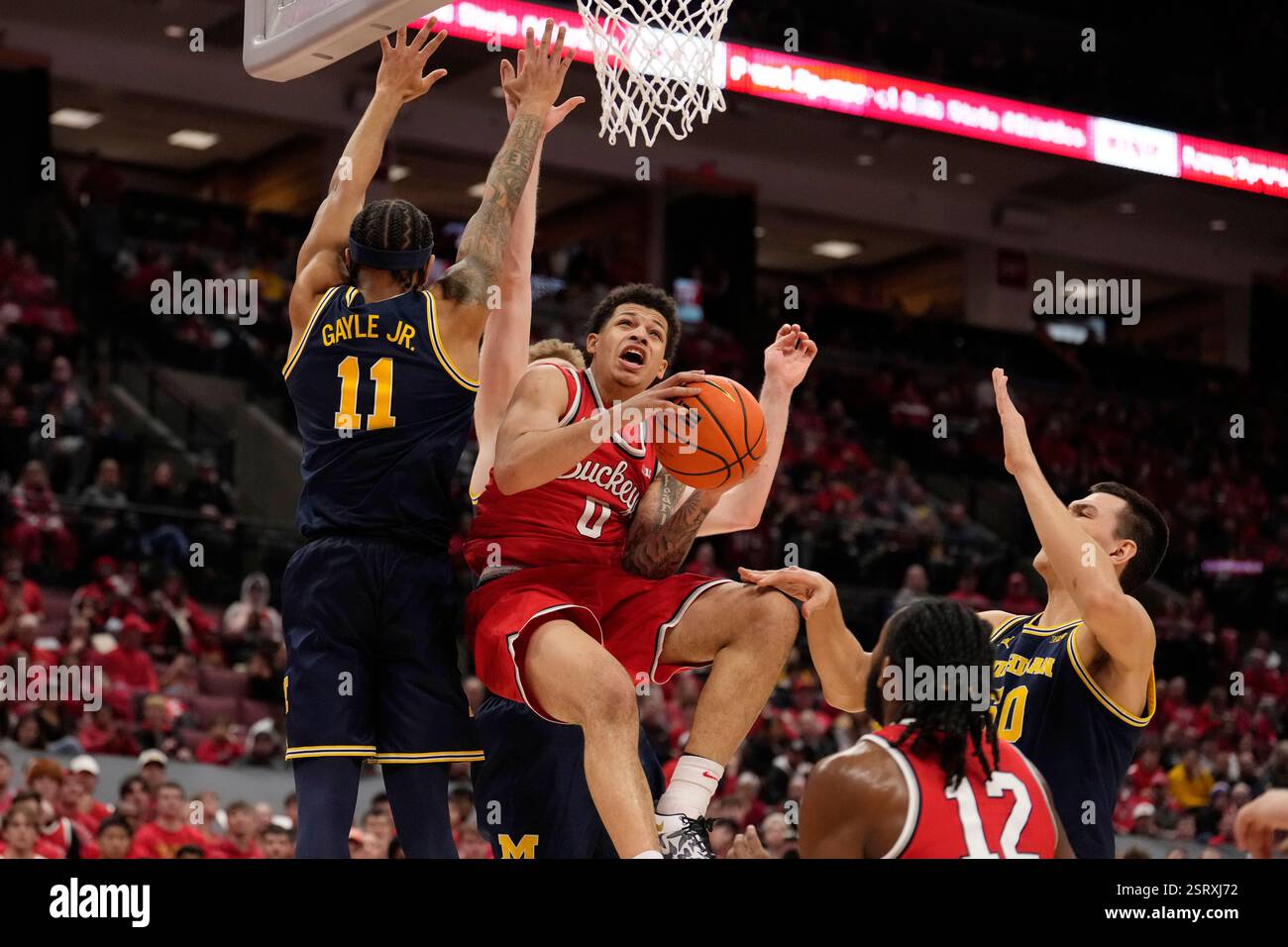 Ohio State guard John Mobley Jr. (0) goes to the basket between ...