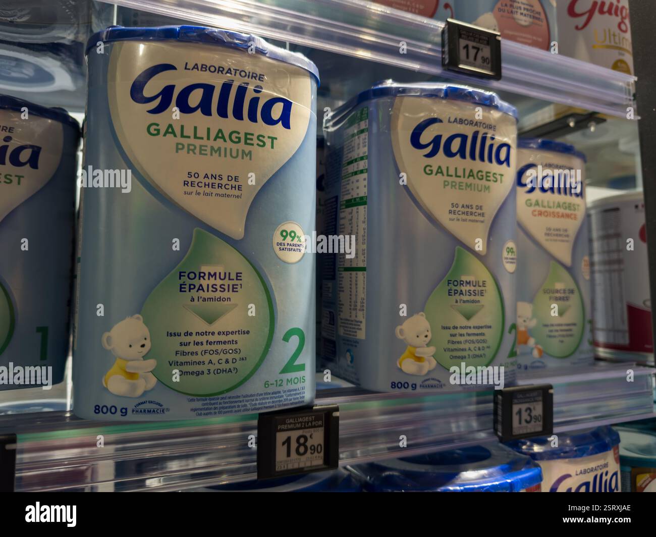 Baby formula products on display in a grocery store aisle in the ...