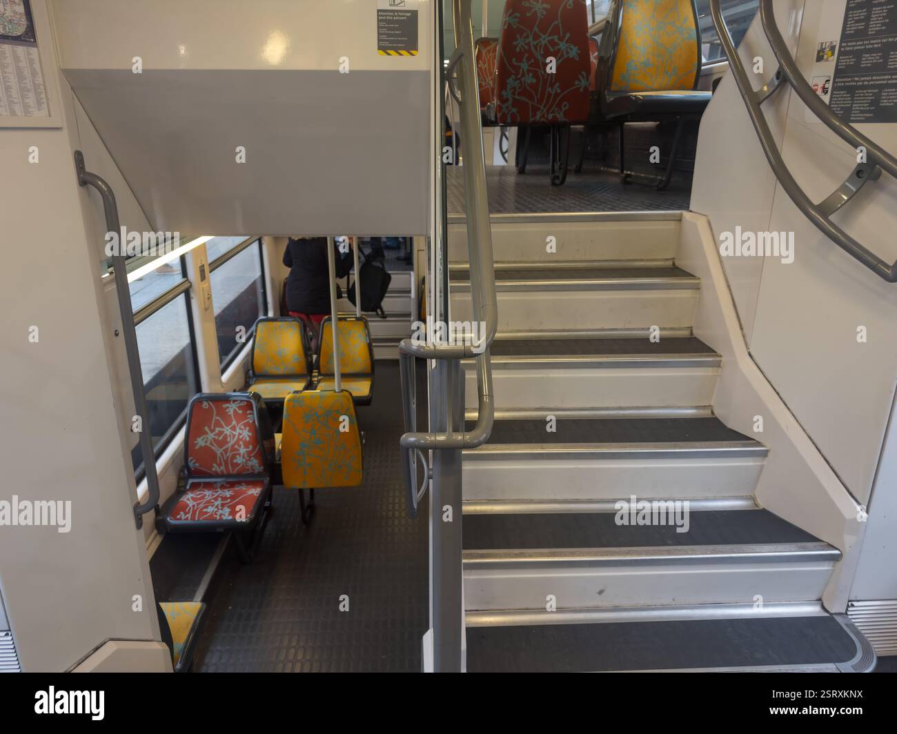 Steps to upper seating in a crowded public transport vehicle Stock ...