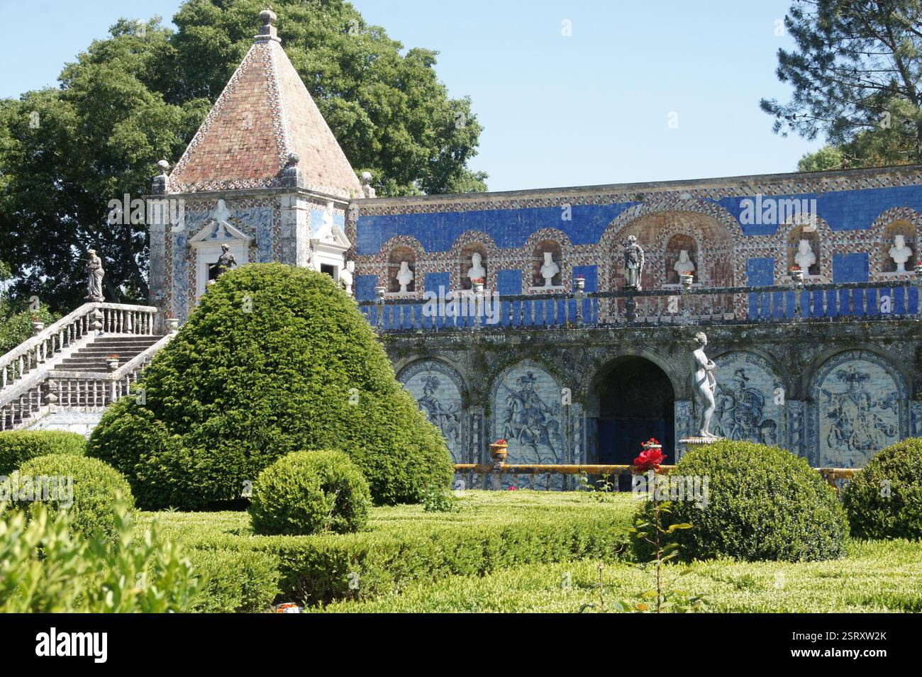 Palacio Fronteira. Blue and white tiled facade. Sculptures and topiary ...