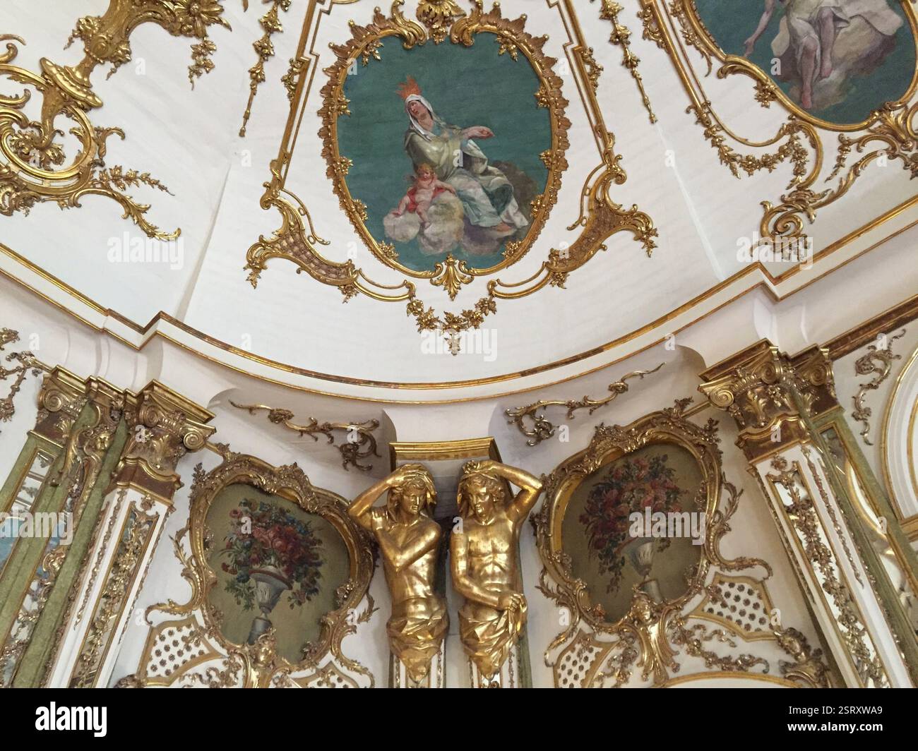 Ceiling painting and decorative elements in a grand hall. Intricate ...