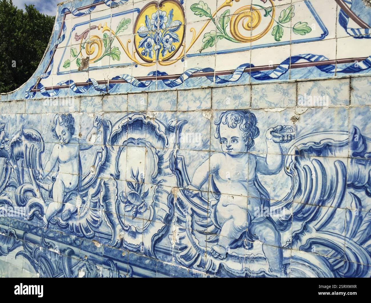 Azulejo tiles depicting cherubs and floral motifs. Blue and white with ...