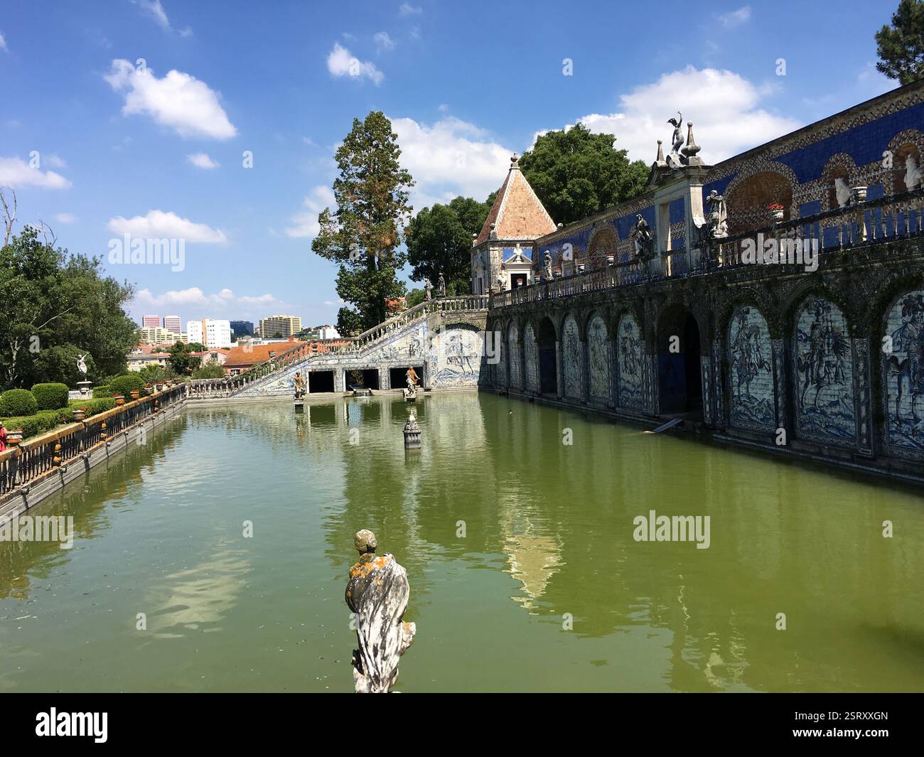 Palace Fronteira in Portugal. Fountain reflects blue sky and clouds ...