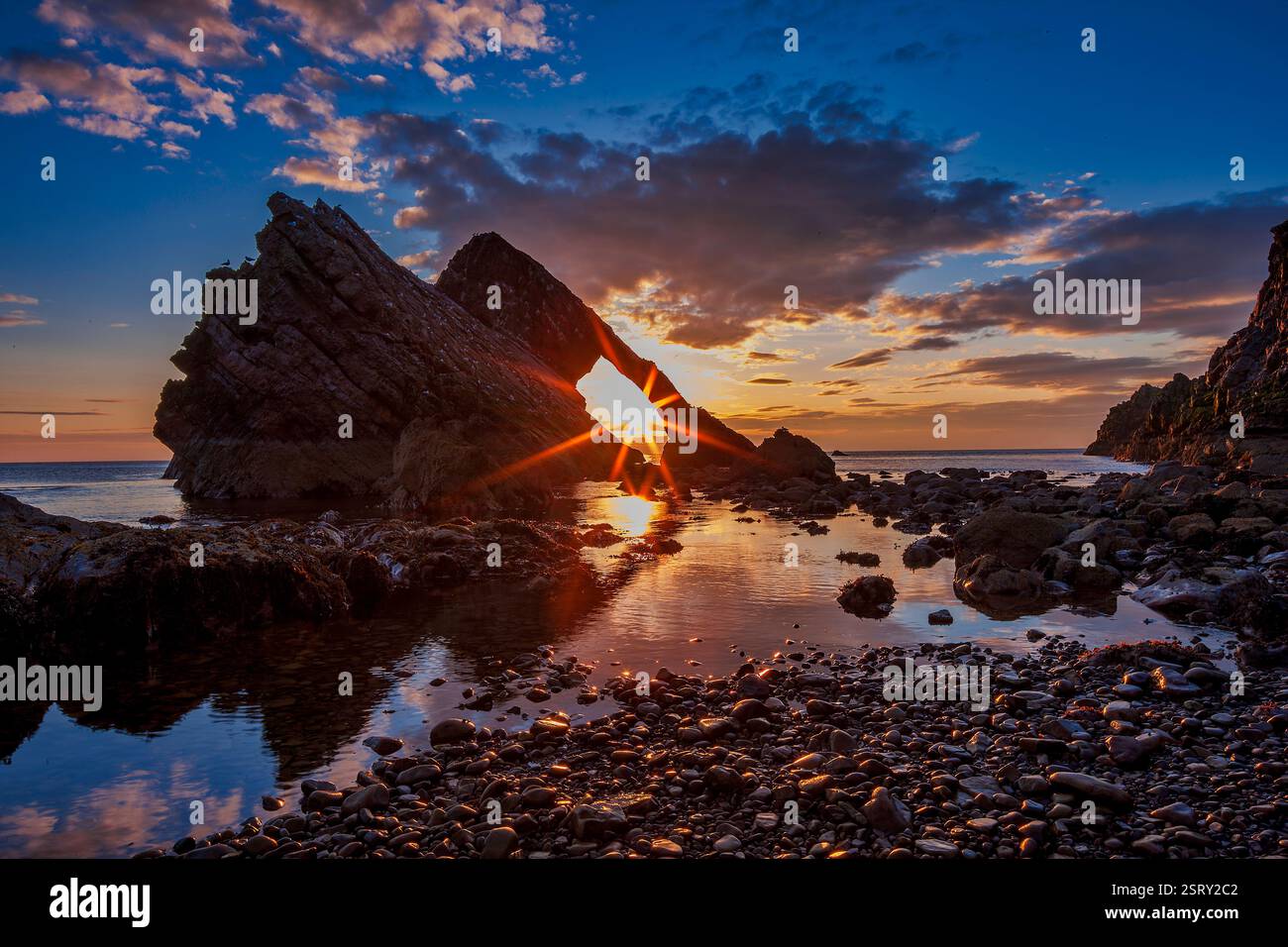 Summer view at dawn of the Bow Fiddle Rock near Portknockie on the ...