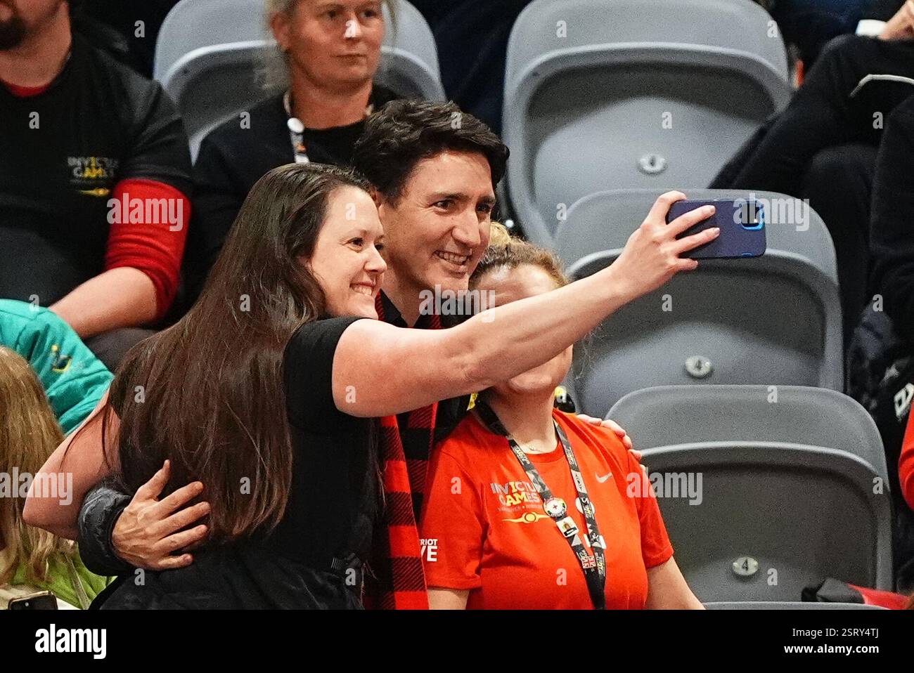 Prime Minister of Canada Justin Trudeau poses for a selfie with members ...