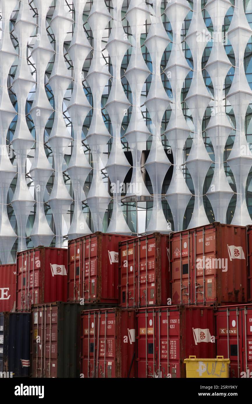 Red shipping containers stacked near the exterior of the the new US ...
