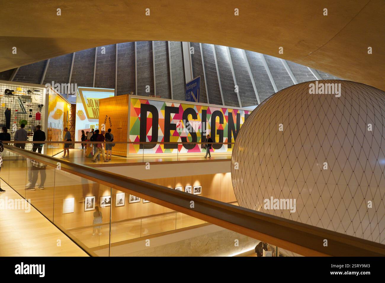 Visitors explore the Design Museum, Nottingham, UK, featuring a large ...