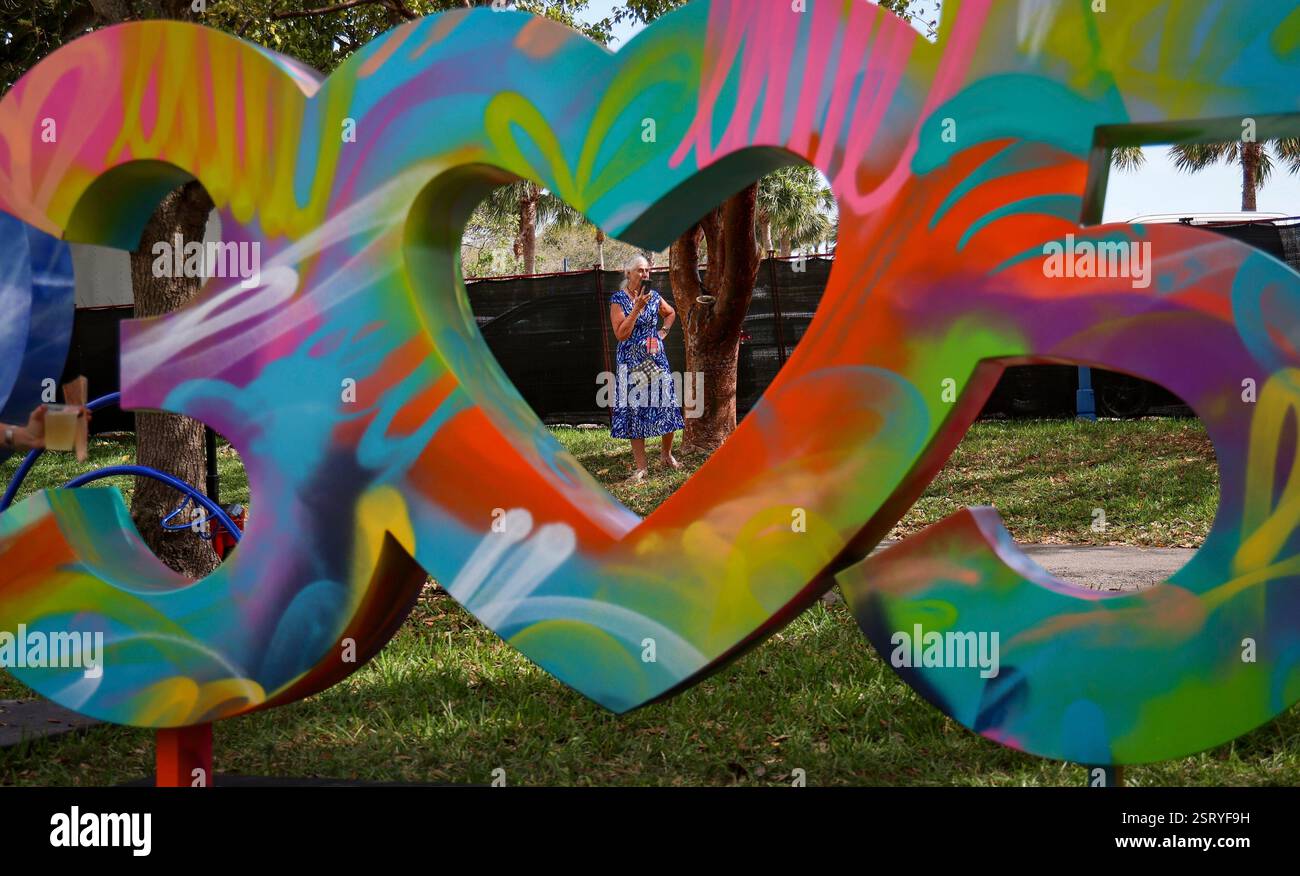 Framed by the sculpture by Scott Gerber of Sarasota, Florida, artist ...